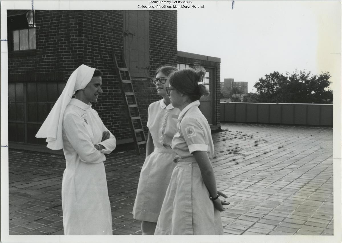 Mercy Hospital staff on roof, Portland, ca. 1975 - Maine Memory Network