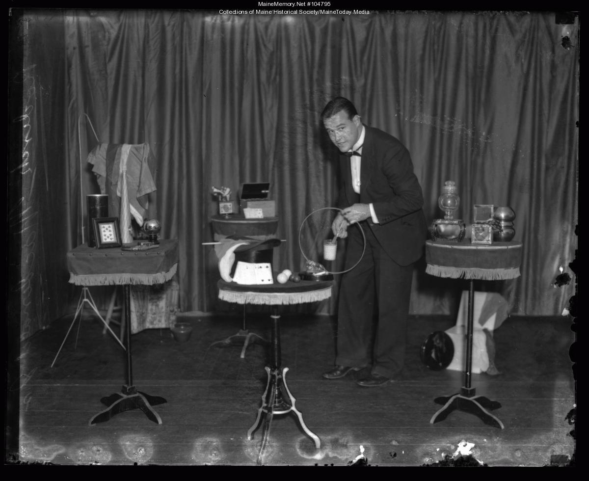 Roderick Macdonald Jr. setting up for a magic show, ca. 1922 - Maine ...