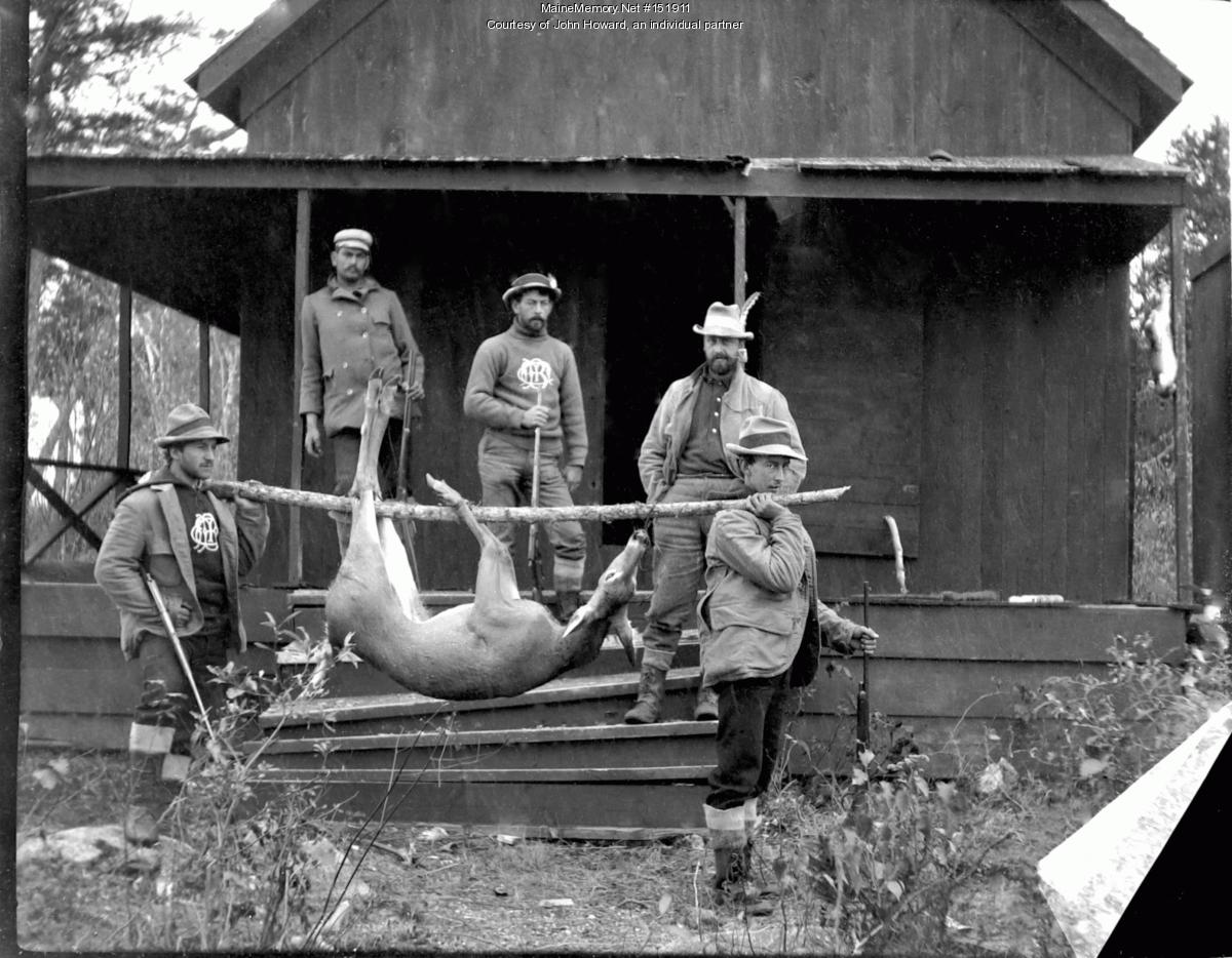 A hunting camp with sportsmen after a successful hunt, ca. 1900 - Maine ...